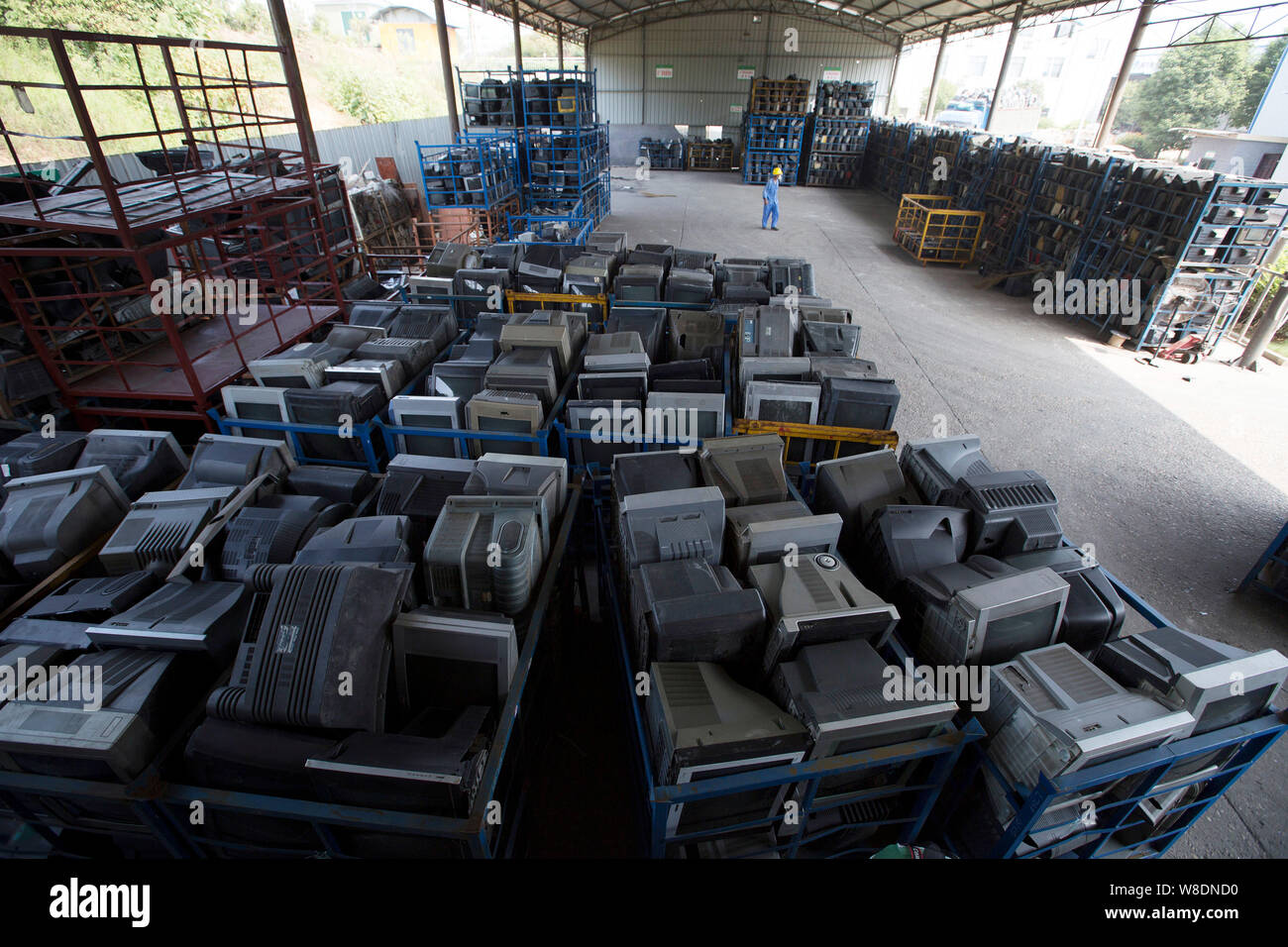 Tube television sets to be disassembled pile up in a plant at the Miluo ...