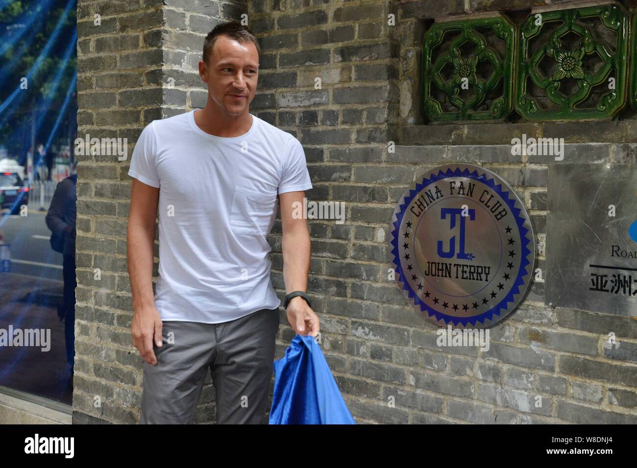 English soccer player John Terry poses during the unveiling ceremony ...