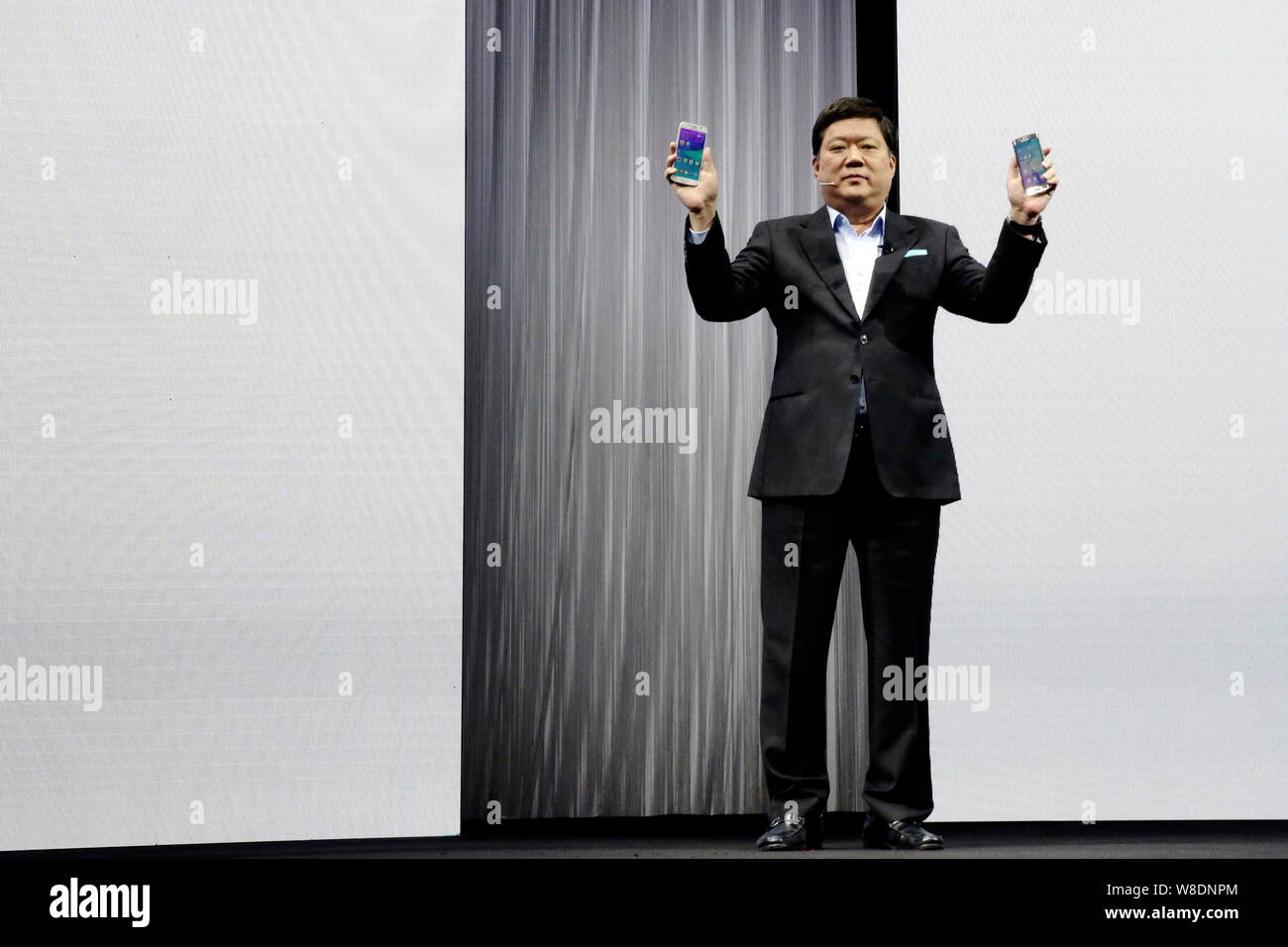 Jaesoon Park, CEO of Samsung Greater China, shows Samsung Galaxy S6 and ...