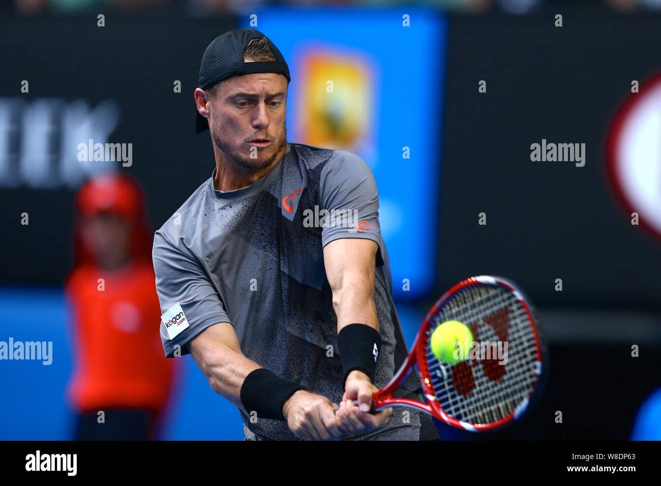 Lleyton Hewitt of Australia returns a shot to Benjamin Becker of ...