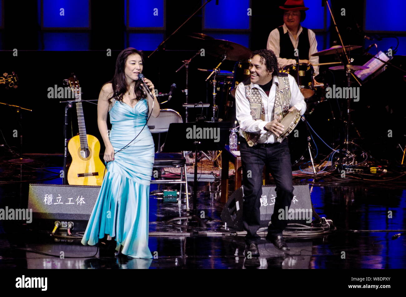 Japanese-Brazilian bossa nova singer Lisa Ono, left, performs at her ...