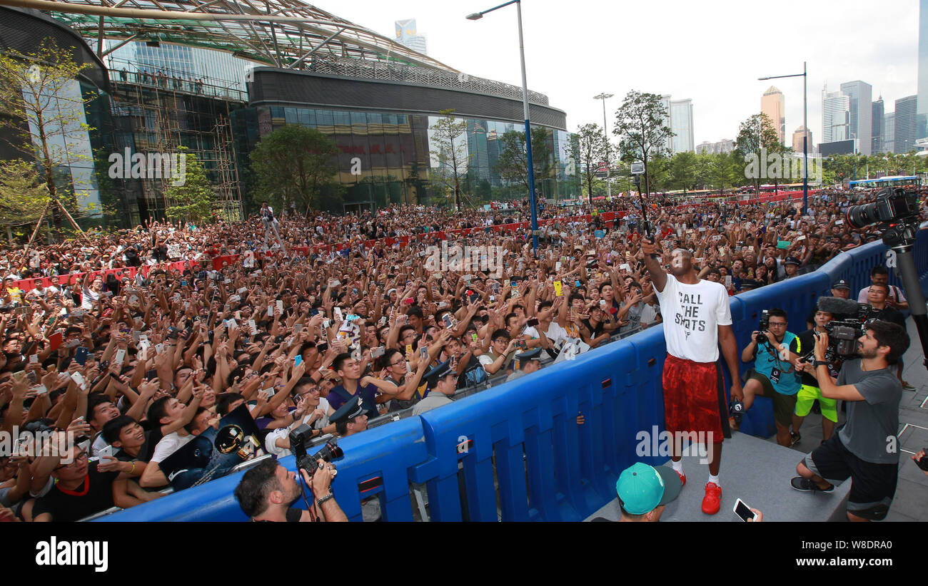 NBA superstar Kobe Bryant takes a selfie in front of a crowd of Chinese ...