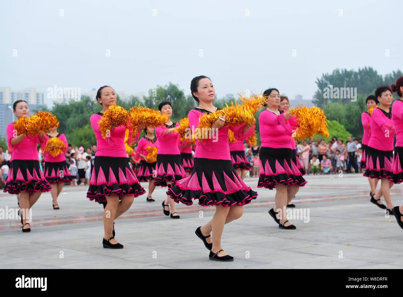 --FILE--Square dancers perform during a dancing festival at a square in ...