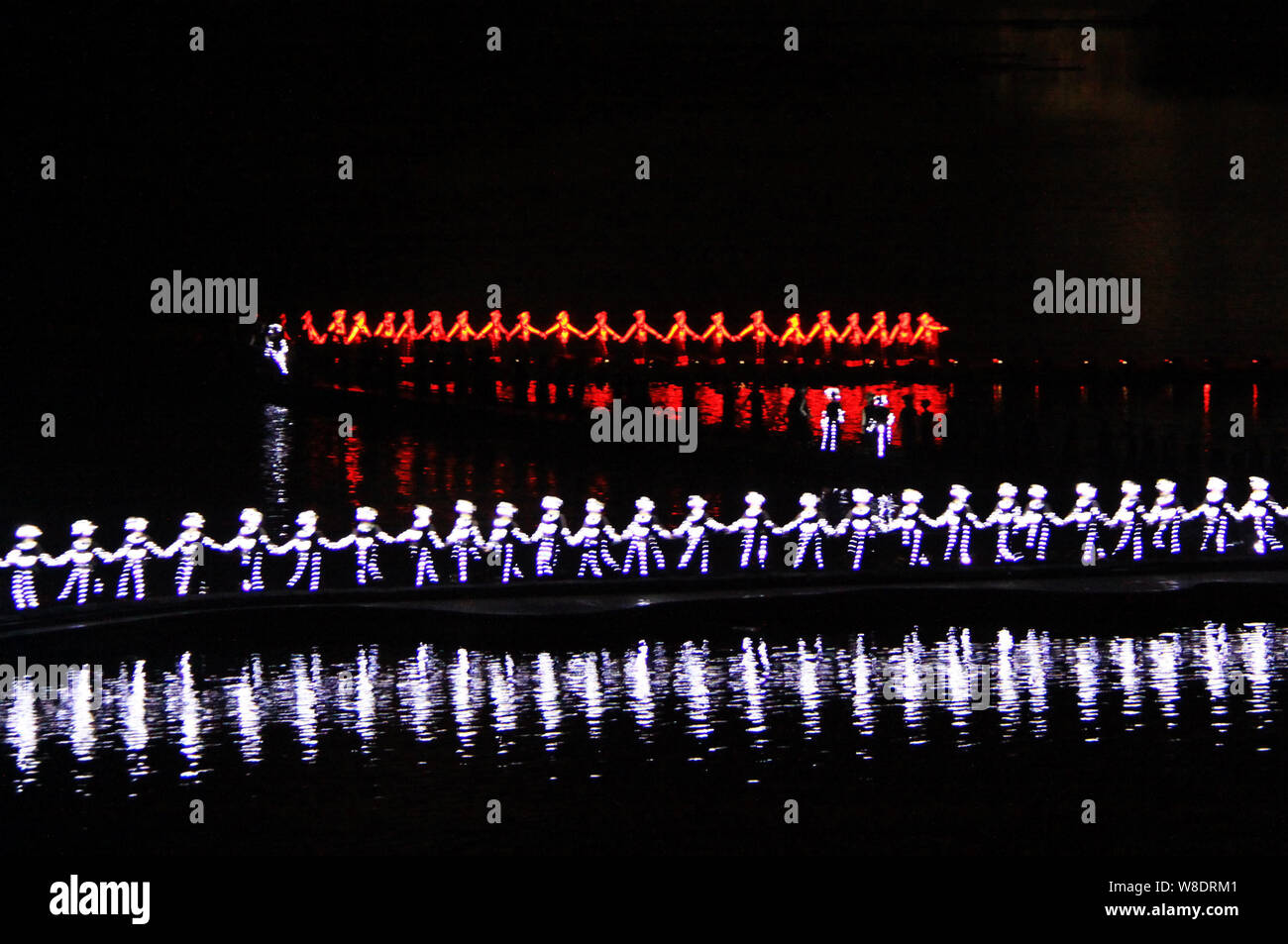 Chinese entertainers perform during a show of the large outdoor ...