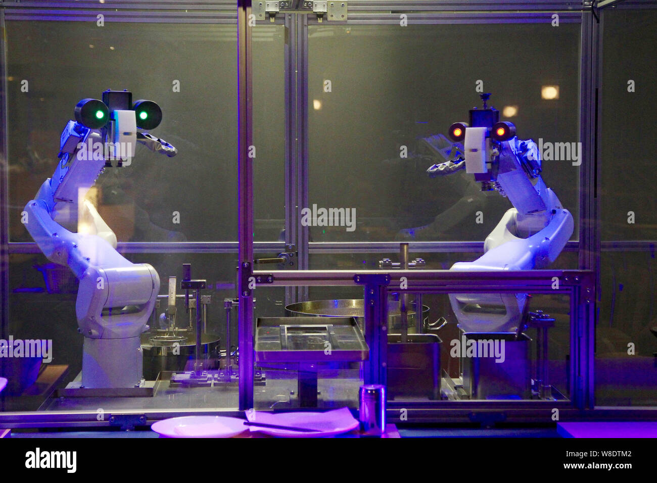 Robots Koya and Kona cook noodles at a new ramen restaurant in Shanghai ...