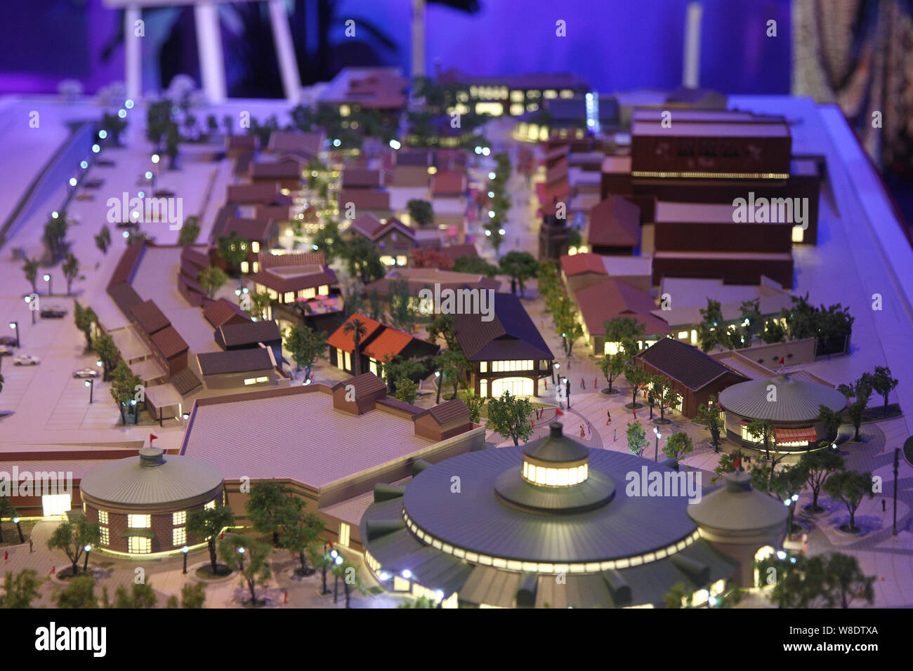 A scale model of the Shanghai Disney Resort is on display during its ...