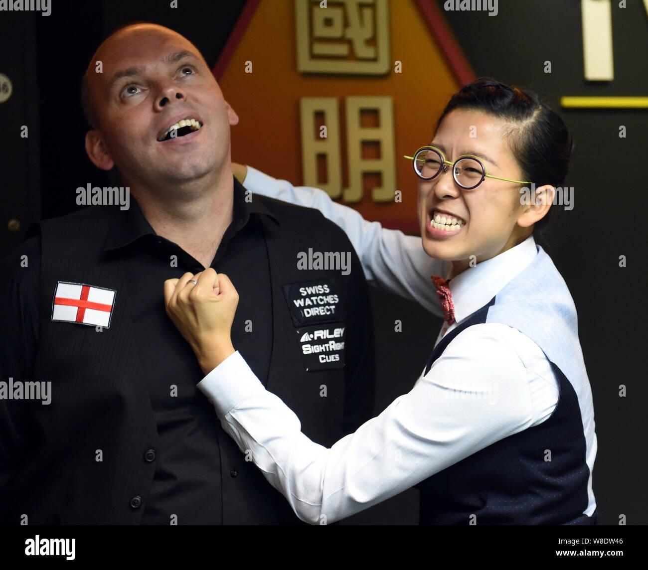 Ng On Yee of Hong Kong, right, interacts with Stuart Bingham of England ...