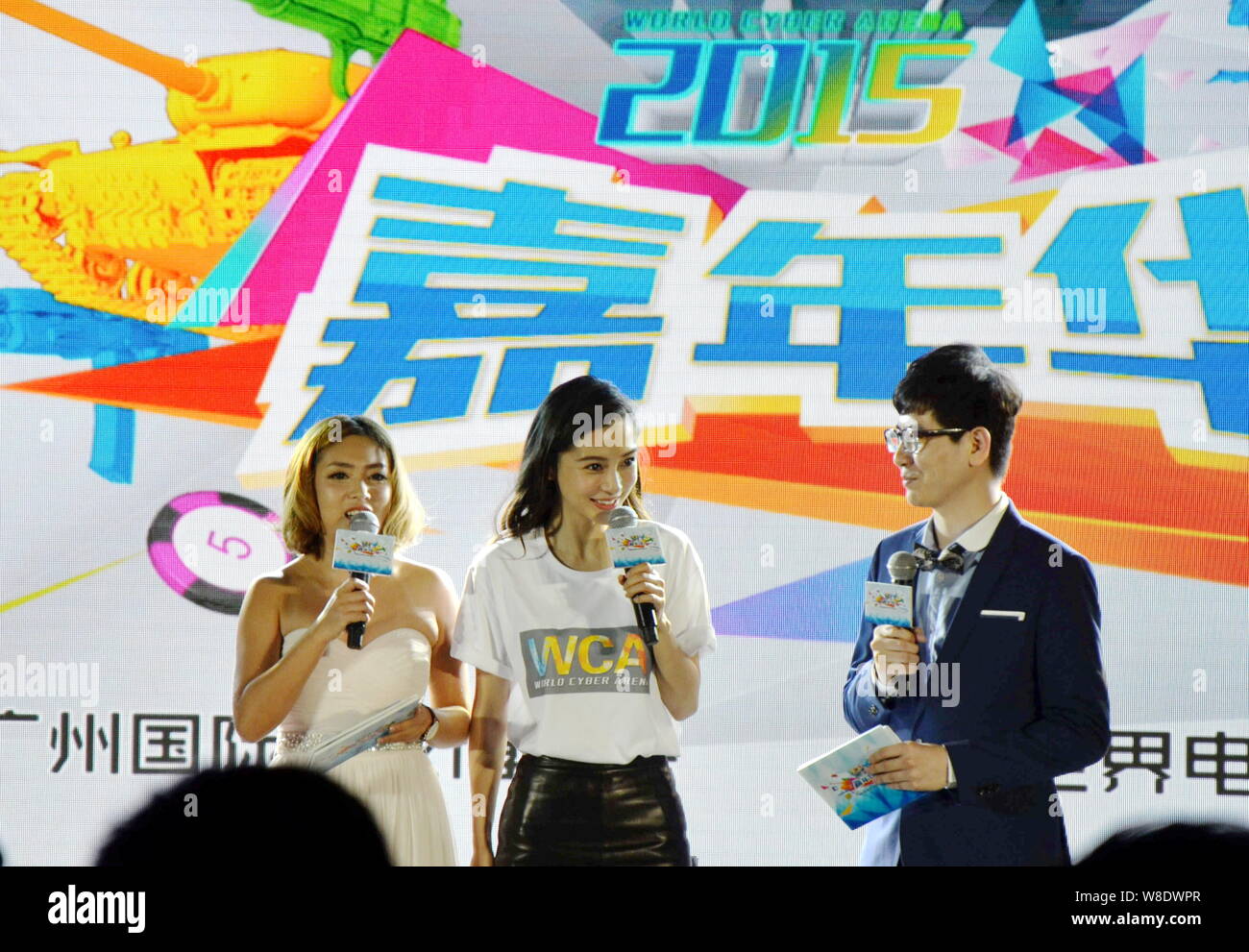 Hong Kong model and actress Angelababy, center, speaks at a WCA (World Cyber Arena) event during ...