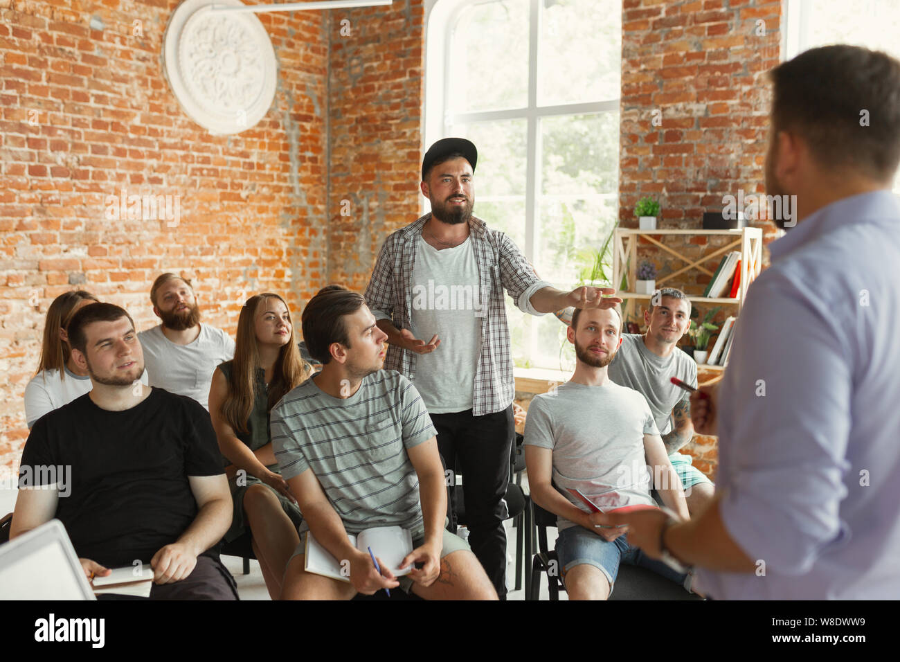 Student asking classmate a question hi-res stock photography and images ...
