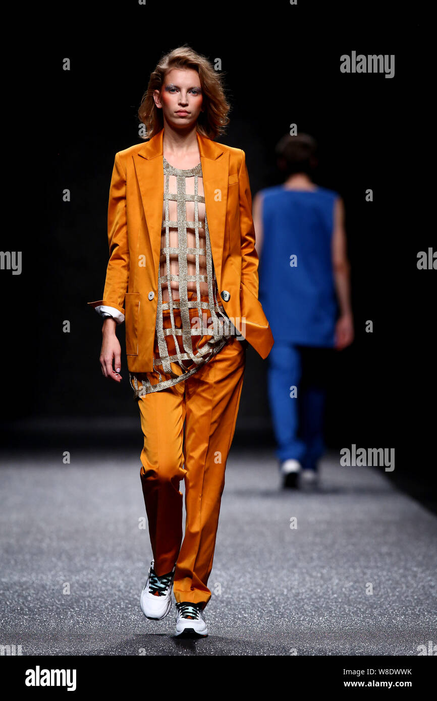 A model displays a new creation at the Nicole Zhang fashion show during ...