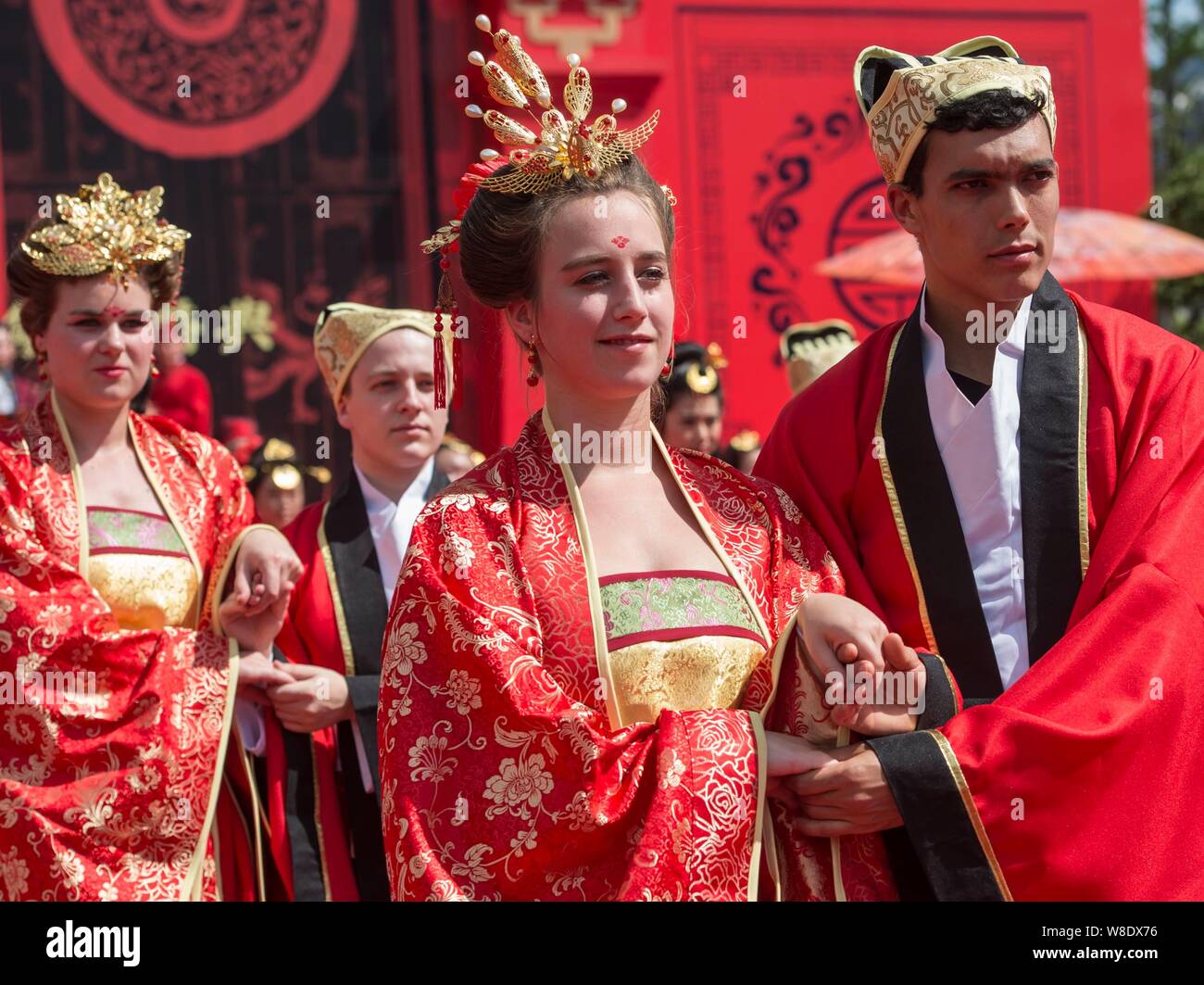 Couples of foreign newlyweds dressed in Chinese Han costumes take part ...