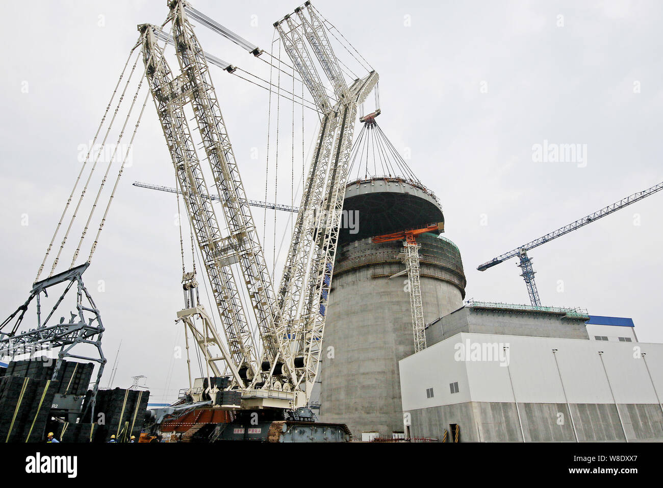 A containment dome for the No.2 reactor is being lifted and installed ...
