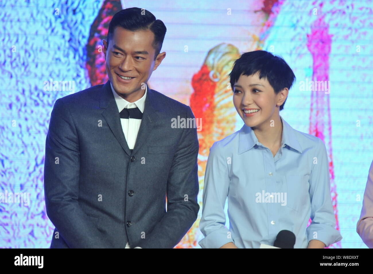 Taiwanese actress Amber Kuo, right, and Hong Kong actor Louis Koo smile ...