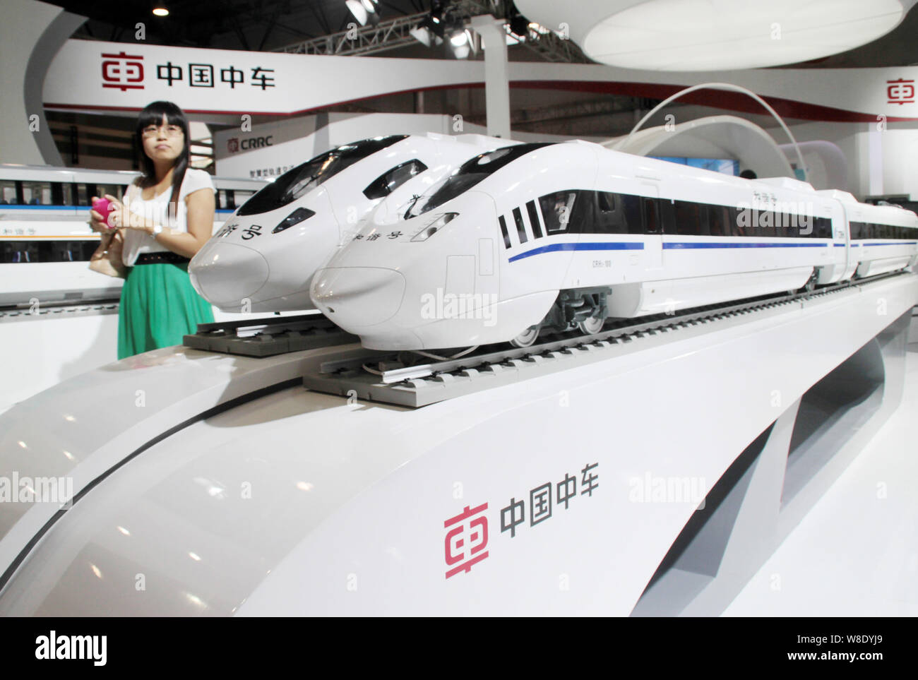 --FILE--A visitor walks past models of CRH (China Railway High-speed ...