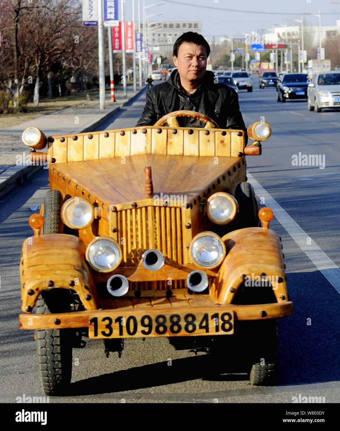 Chinese carpenter Liu Fulong test-drives his third homemade wooden ...