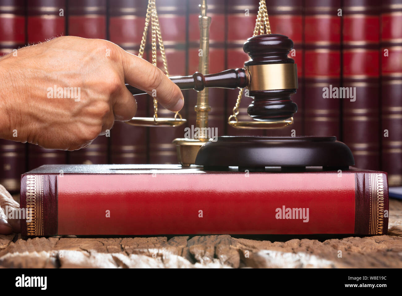 Male Judge In A Courtroom Striking The Gavel Stock Photo - Alamy