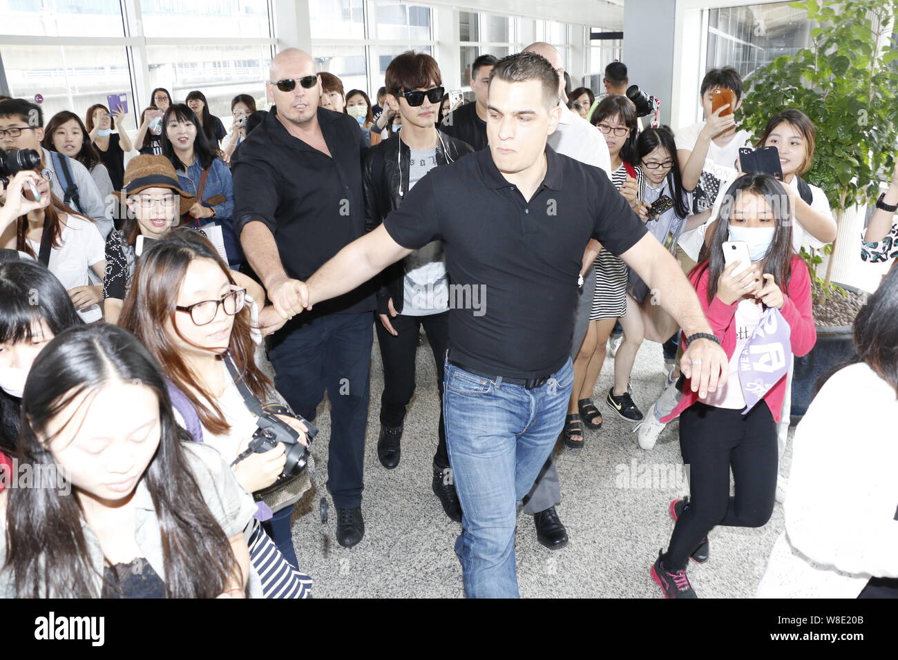 Singer and actor Shim Chang-min, center, also known by his stage name ...