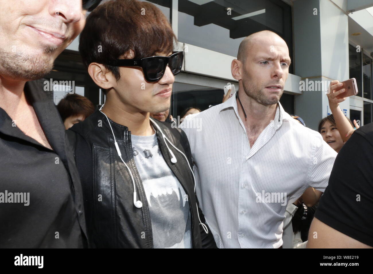 Singer and actor Shim Chang-min, center, also known by his stage name ...
