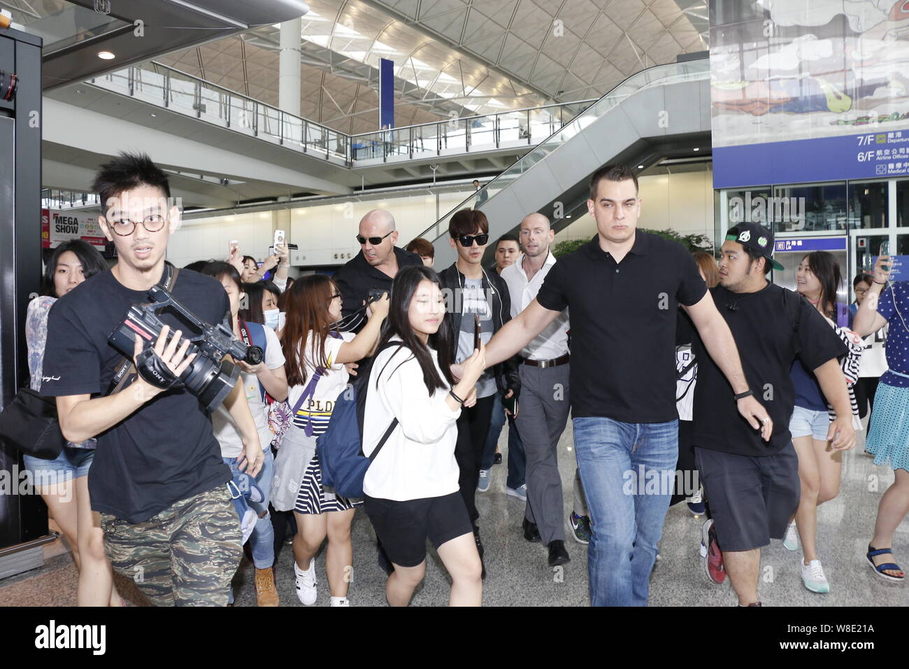 Singer and actor Shim Chang-min, center, also known by his stage name ...