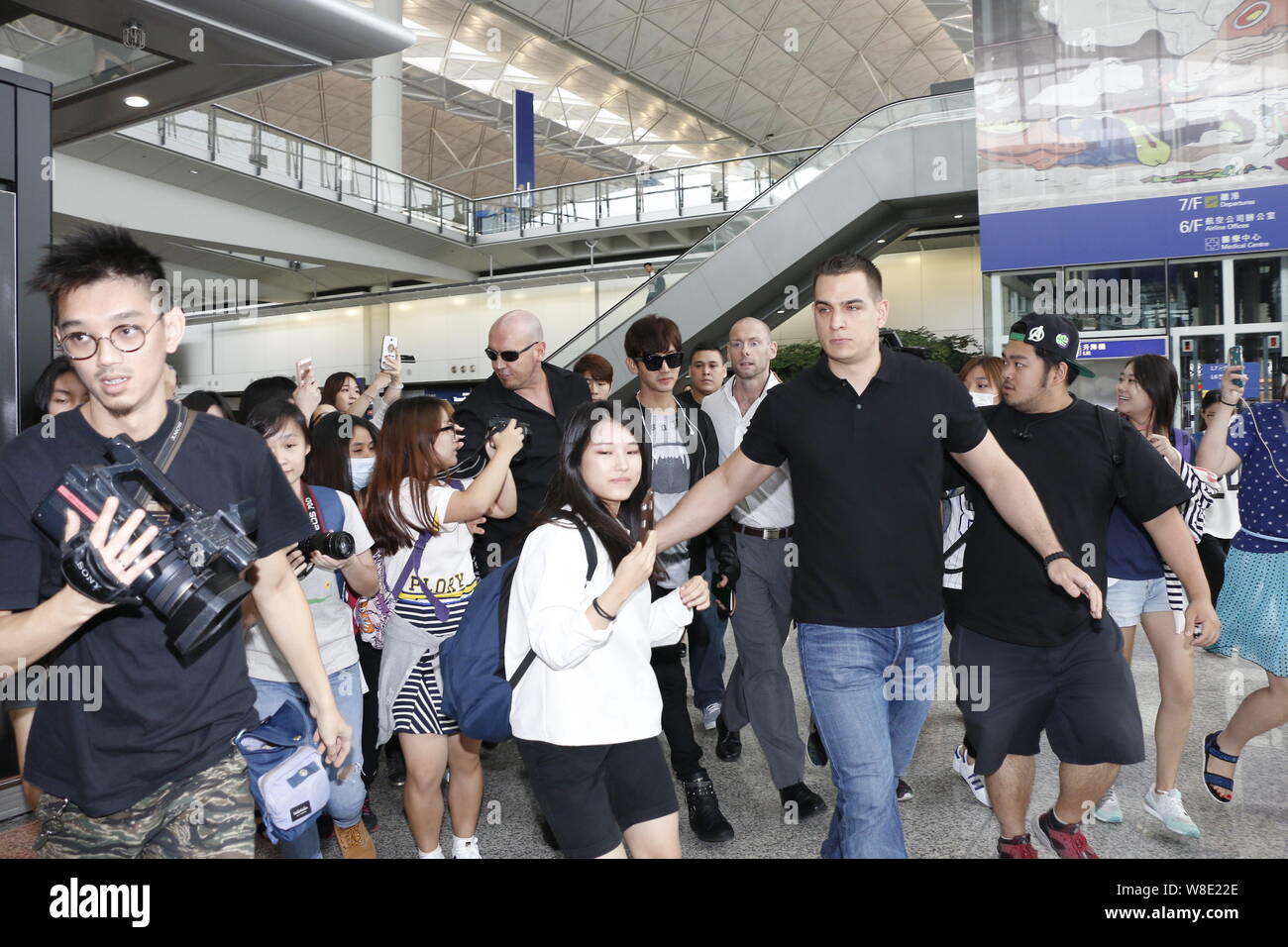Singer and actor Shim Chang-min, center, also known by his stage name ...