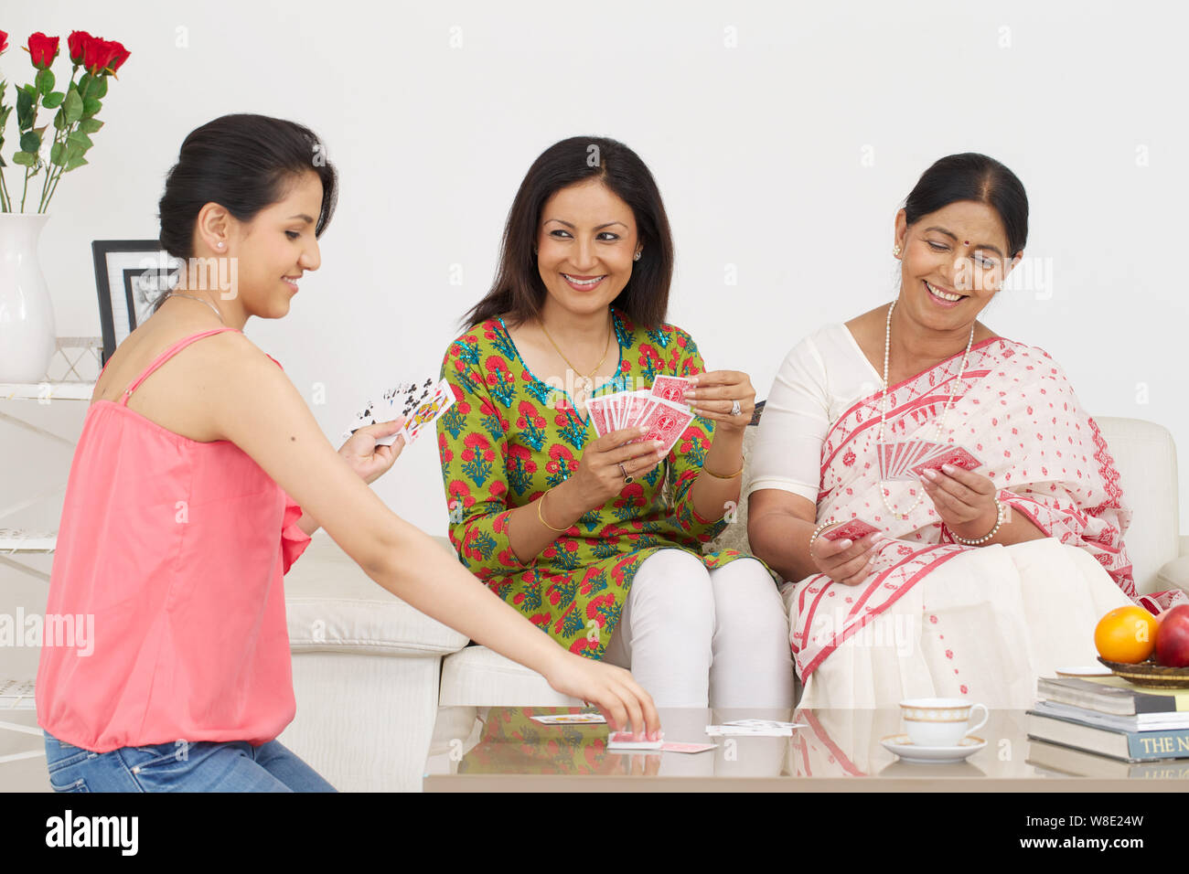 Family playing cards at home Stock Photo - Alamy