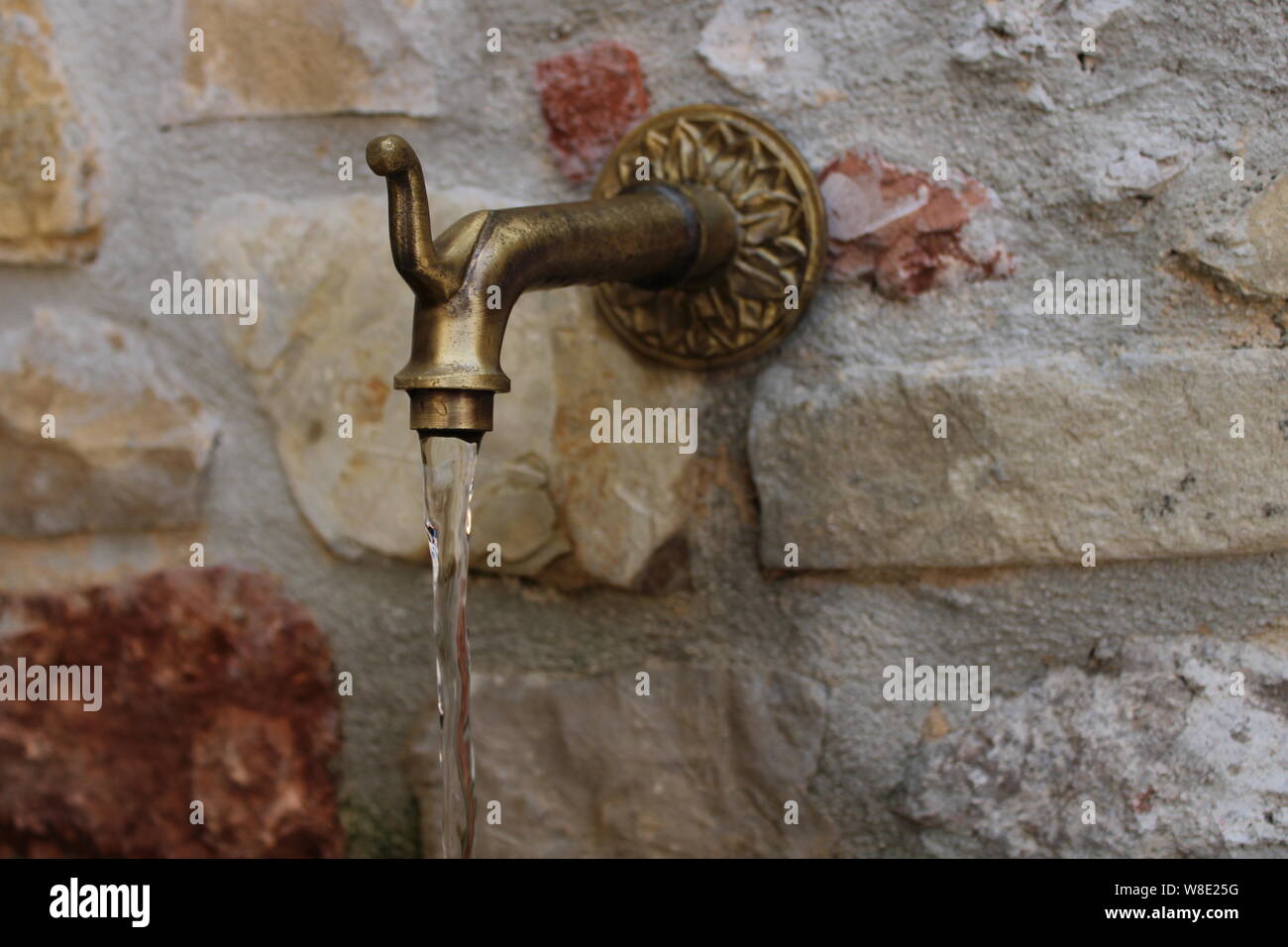 water fountain with water and light coloured bricks Stock Photo - Alamy