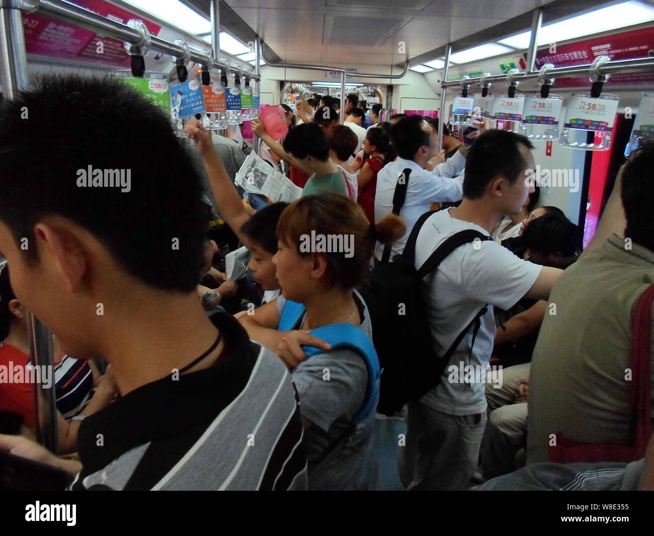 --FILE--Passengers crowd a subway train during rush hour in Beijing ...