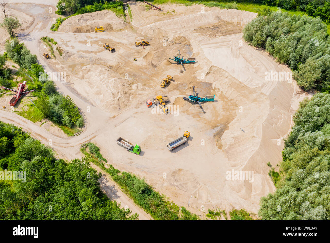 Aerial view of sandpit and factory plant producing sand materials for ...