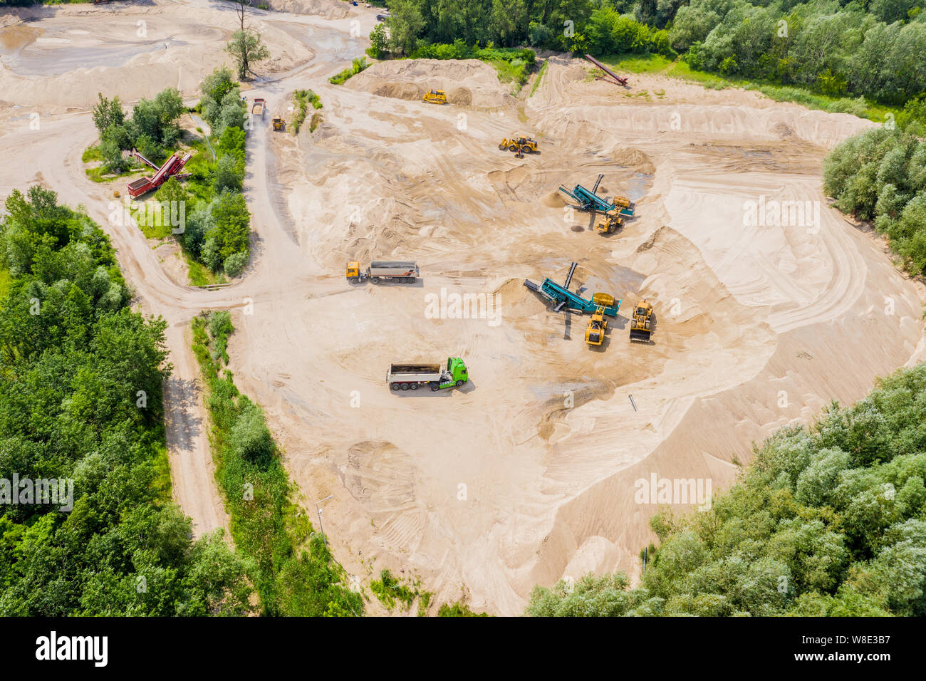 Aerial view of sandpit and factory plant producing sand materials for ...
