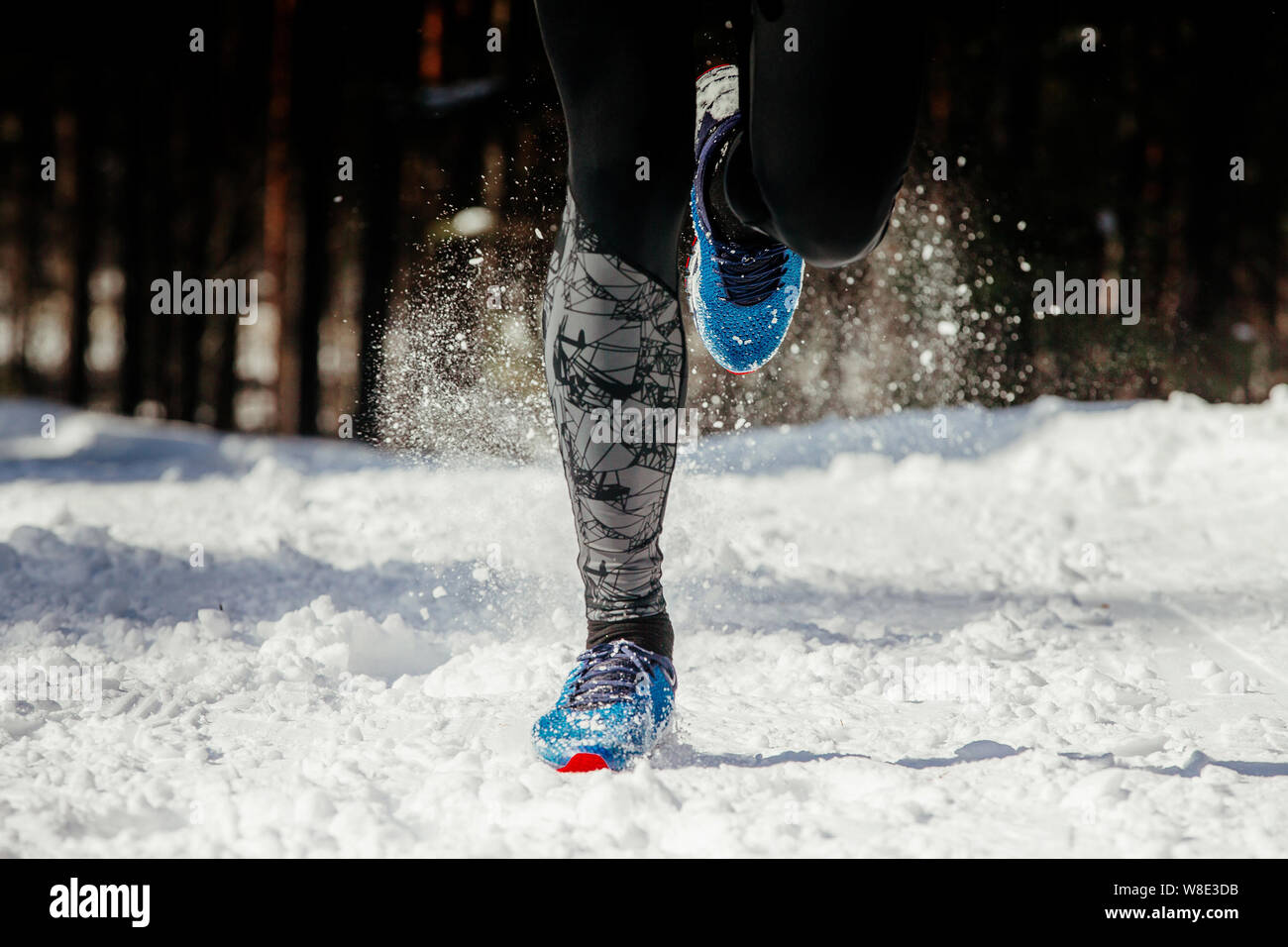 legs athlete runner running in winter snow trail Stock Photo - Alamy