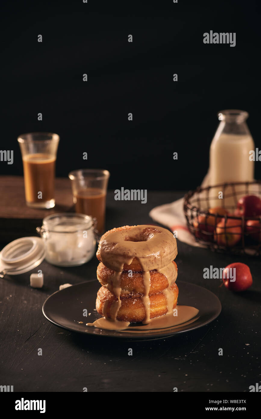 Close-up of donuts in stack with milk bottle and glass Stock Photo - Alamy
