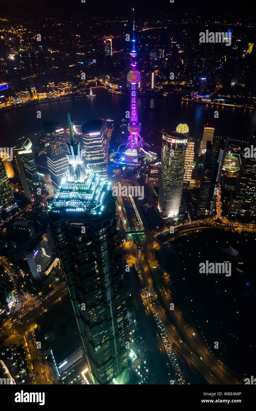 This picture taken from high in the Shanghai World Financial Center shows a night view of Puxi ...