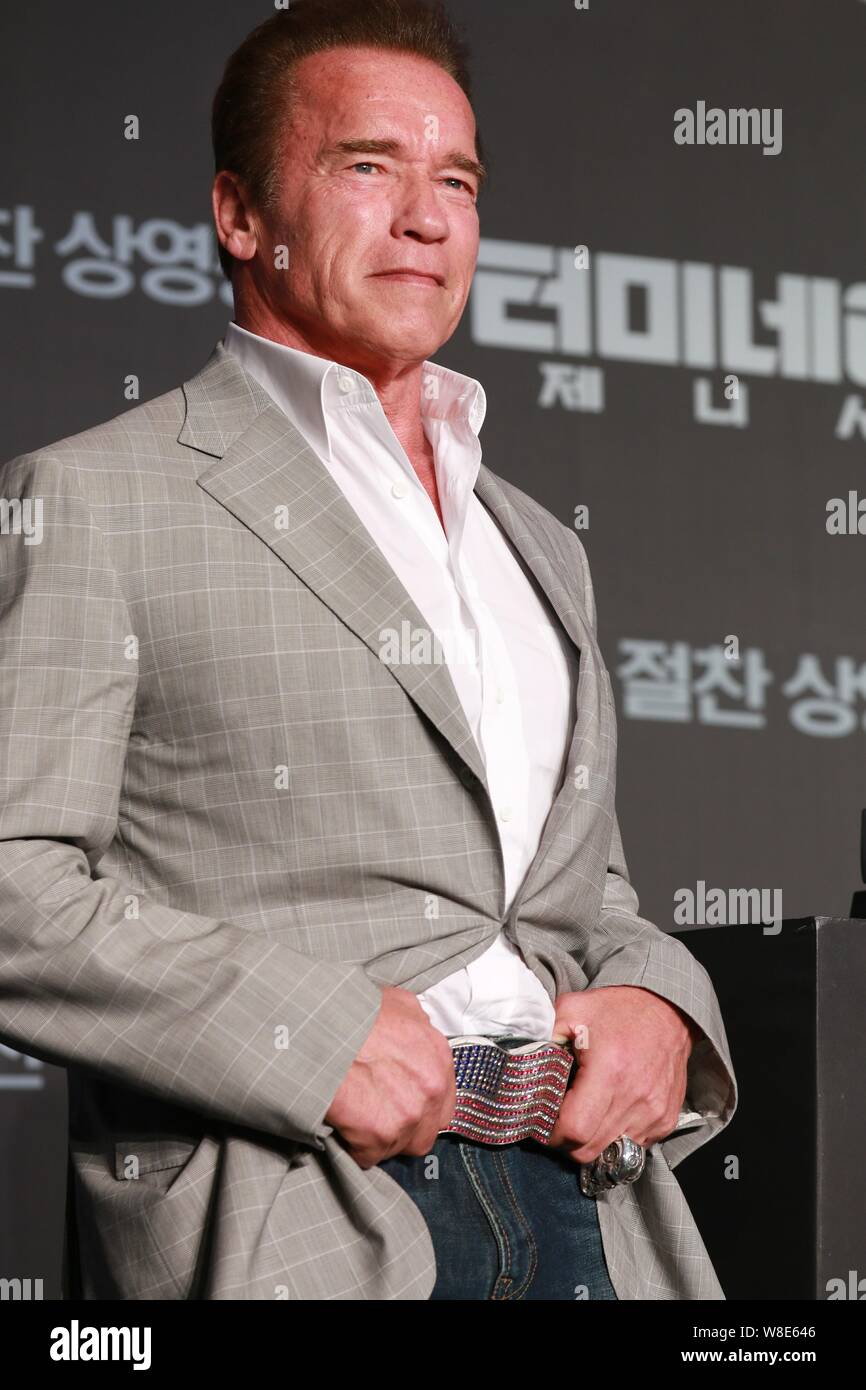 American actor Arnold Schwarzenegger adjusts his jeans during a press ...