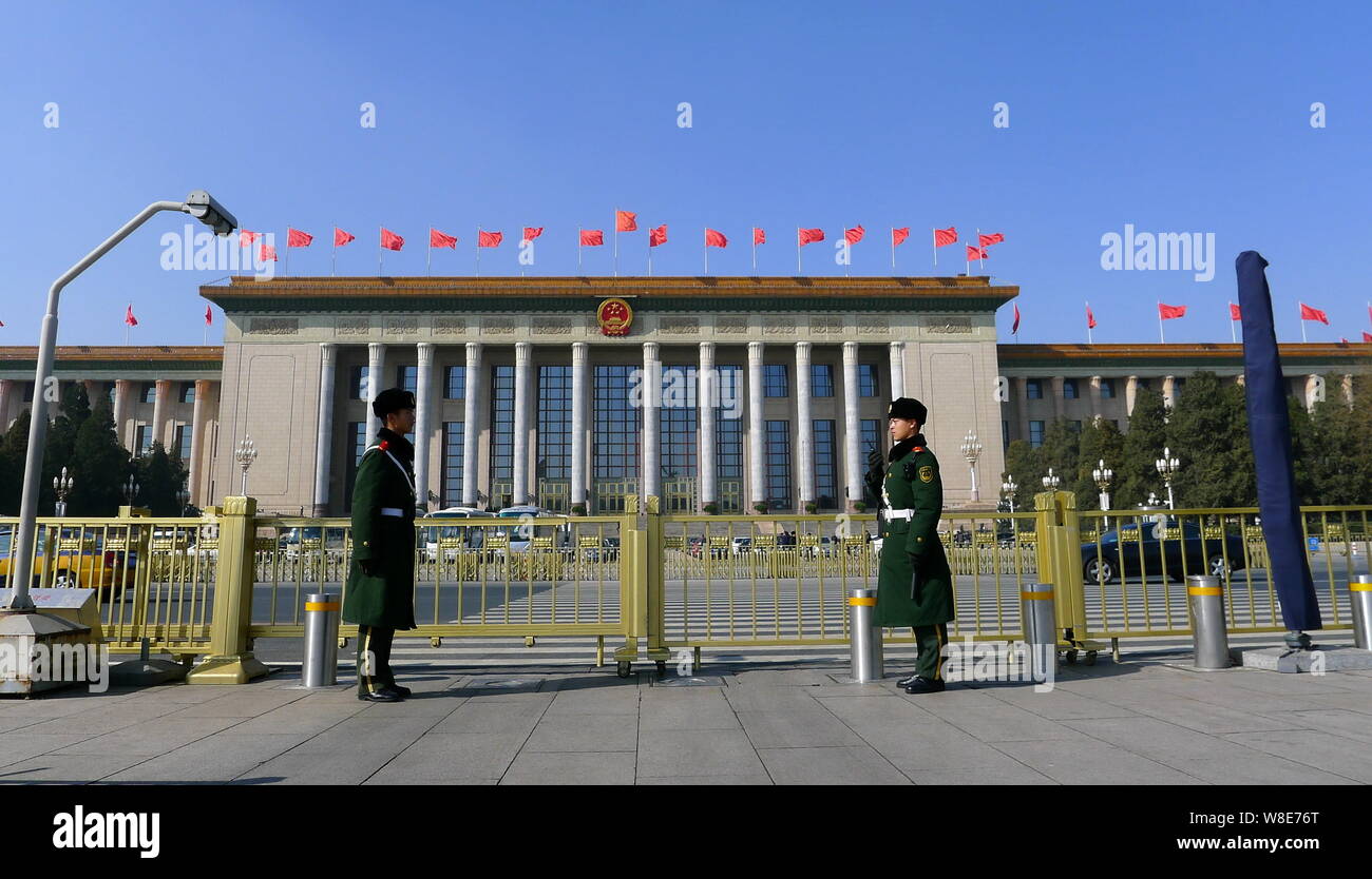 Chinese paramilitary policemen stand guard in front of the Great Hall ...