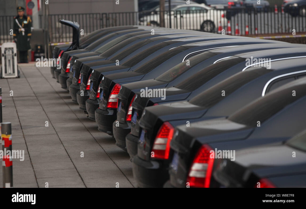 --FILE--Government cars to be auctioned are seen in a parking lot in ...