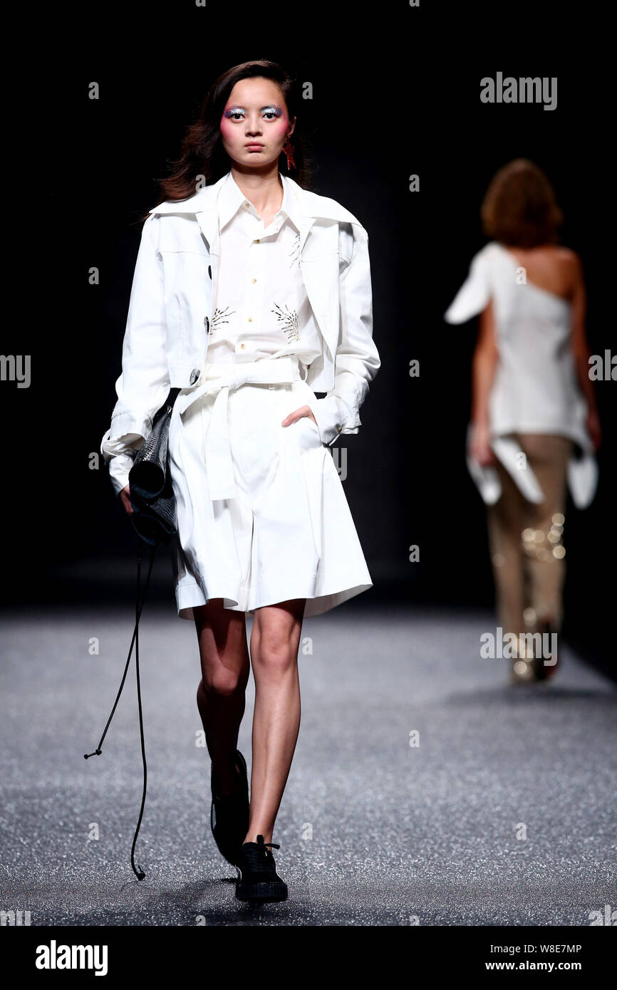 A model displays a new creation at the Nicole Zhang fashion show during ...