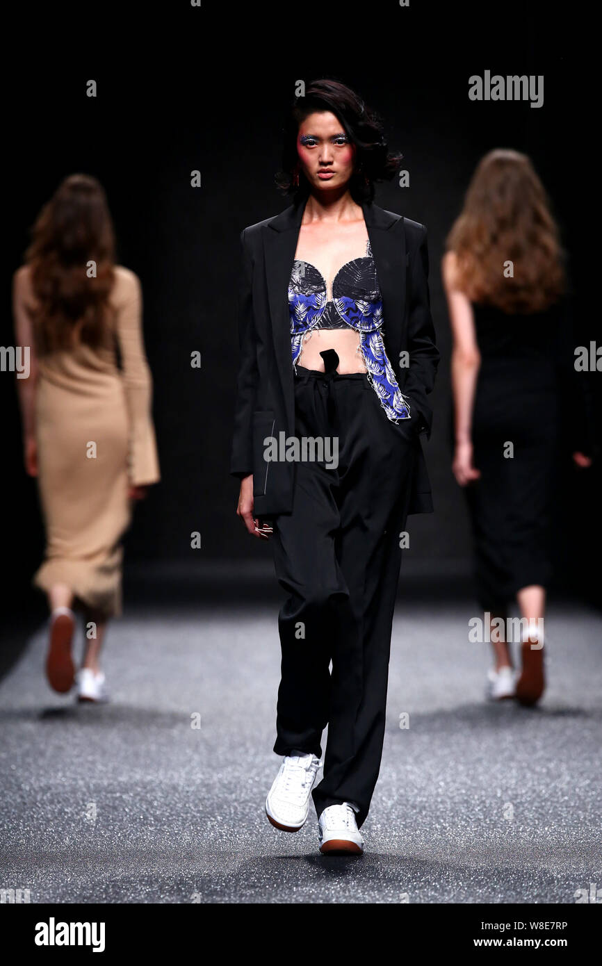 A model displays a new creation at the Nicole Zhang fashion show during ...