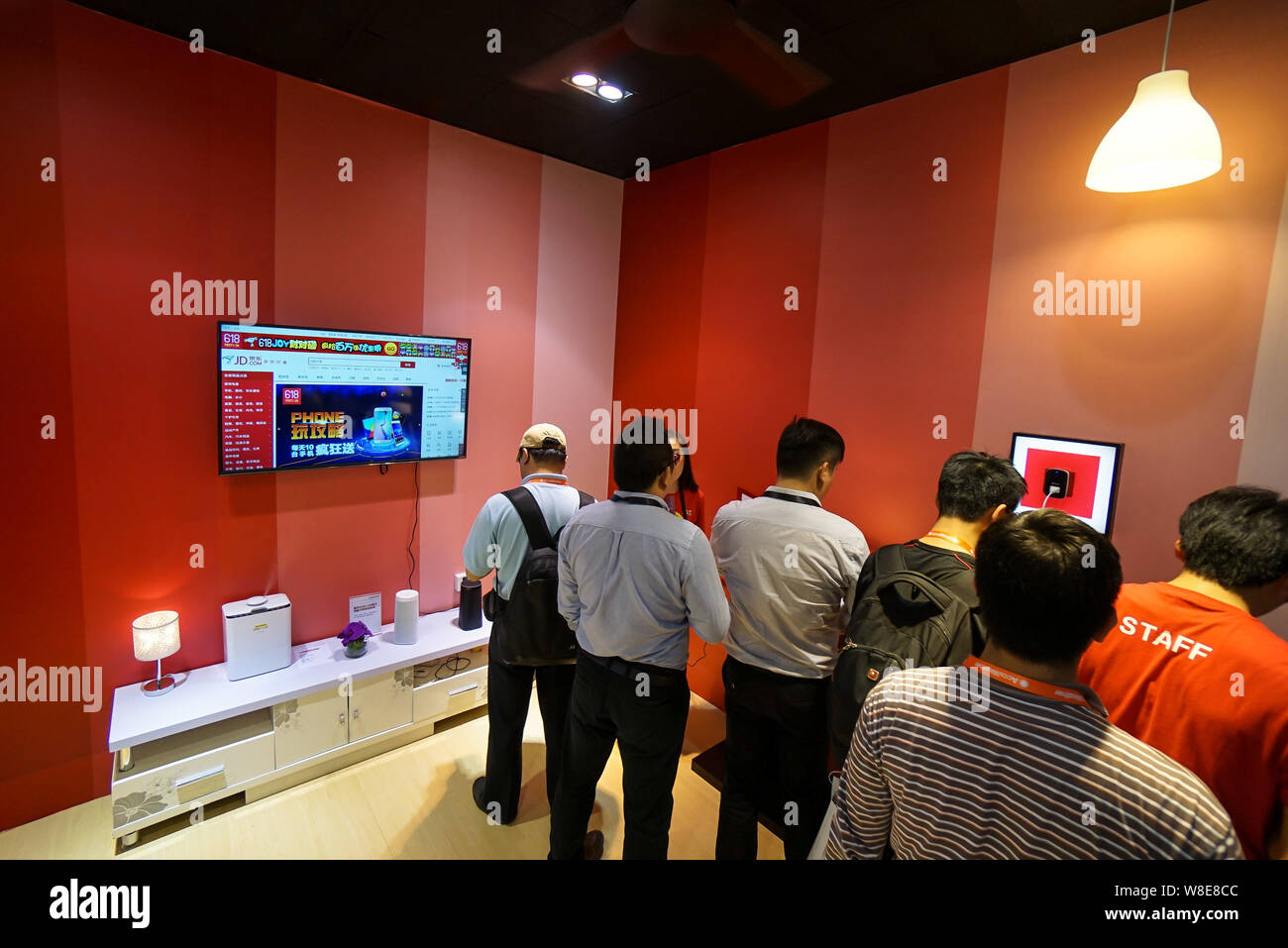 Chinese employees introduce the "smart home" eco-system to visitors at ...