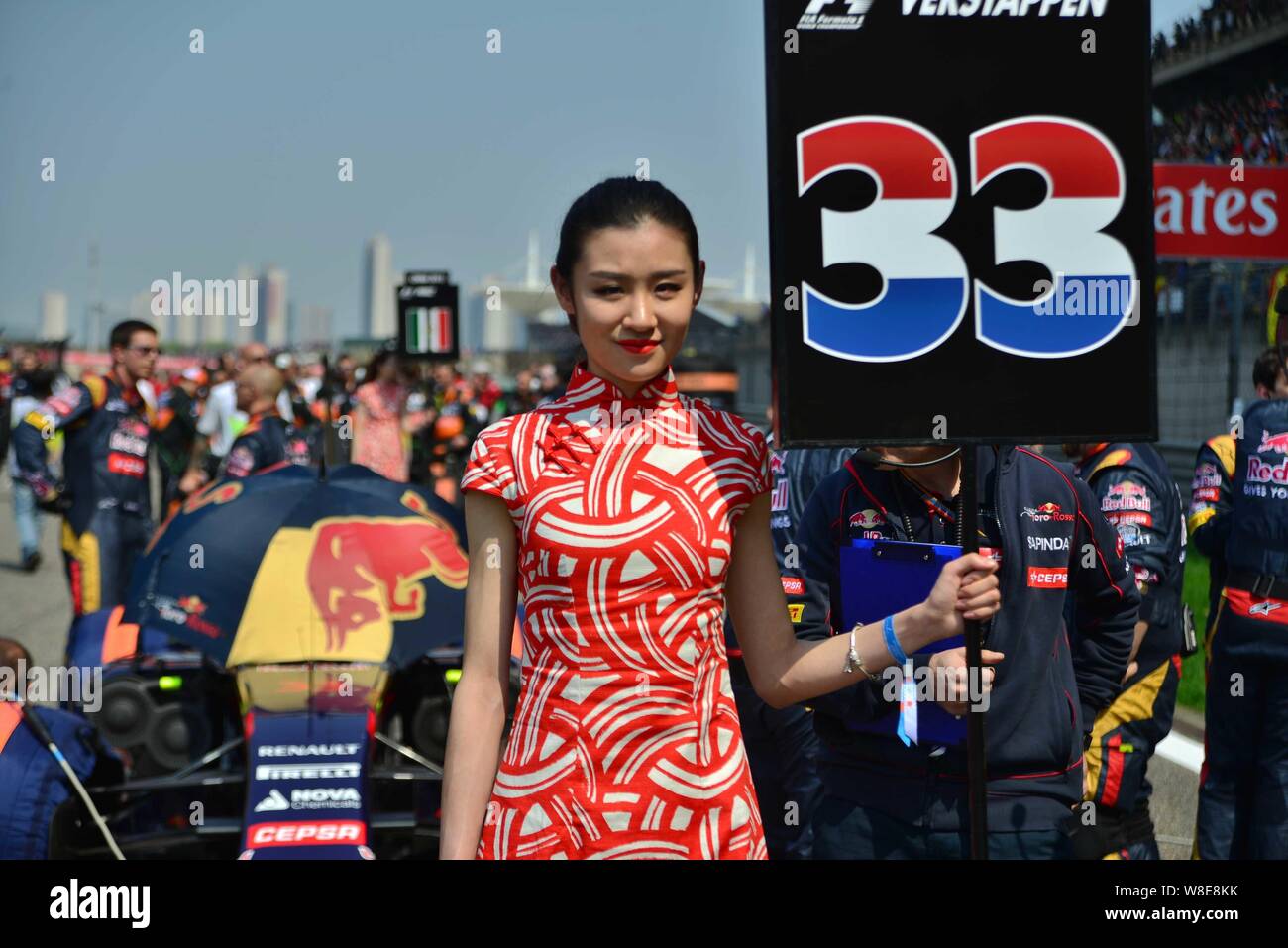 A hostess poses in front of the racing car of Netherlands' Max ...