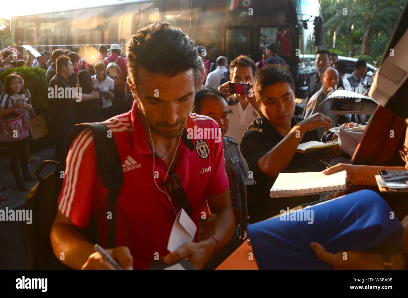 Gianluigi Buffon of Juventus signs an autograph for a fan as he arrives ...