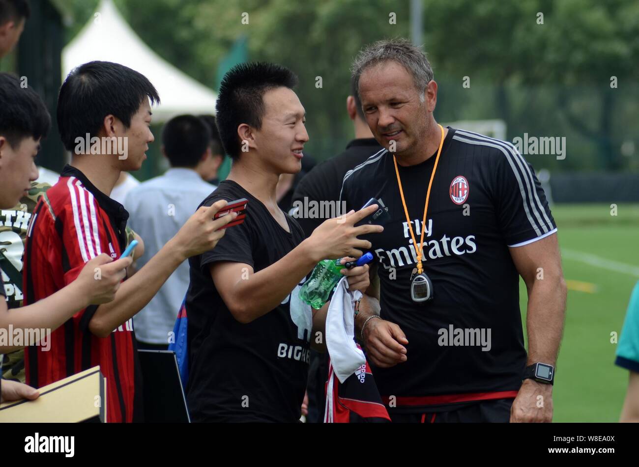 Keisuke Honda of AC Milan, right, talks with Chinese fans during a ...