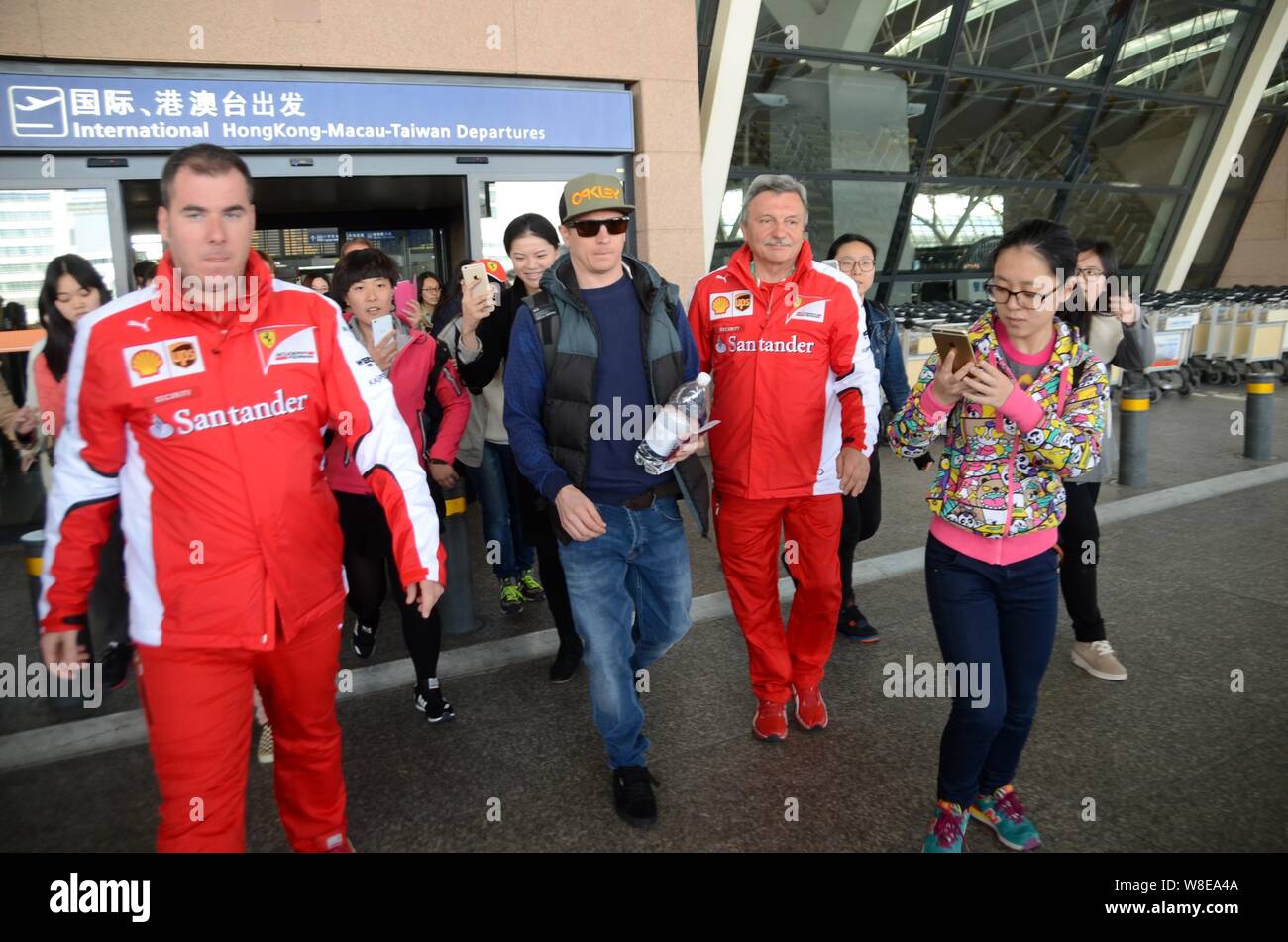 Finnish F1 driver Kimi Raikkonen of Ferrari, center, is pictured after ...