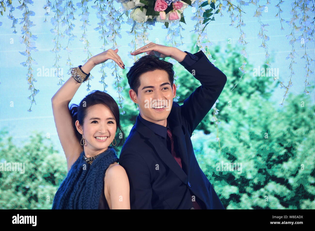 Taiwanese singer and actress Ariel Lin, left, singer and actor Vic Chou pose at a press ...