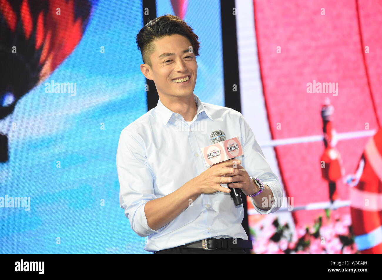 Taiwanese actor Wallace Huo Chien-hwa reacts at a press conference for ...
