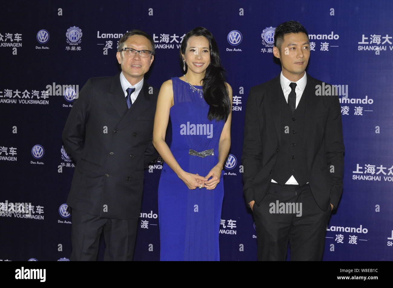 Hong Kong singer and actress Karen Mok, center, singer and actor Shawn ...