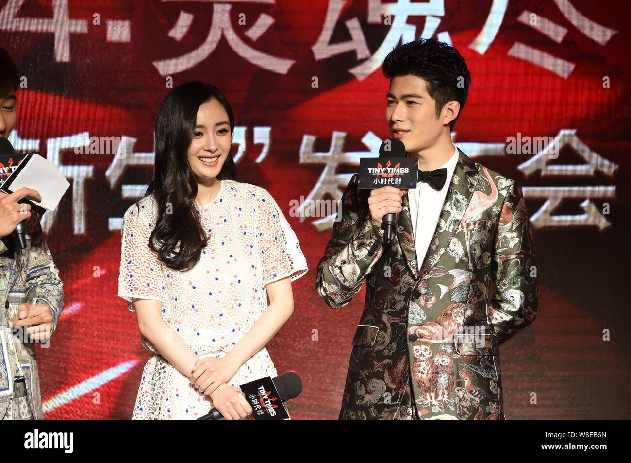Chinese actress Yang Mi, left, smiles as actor Chen Xuedong speaks ...