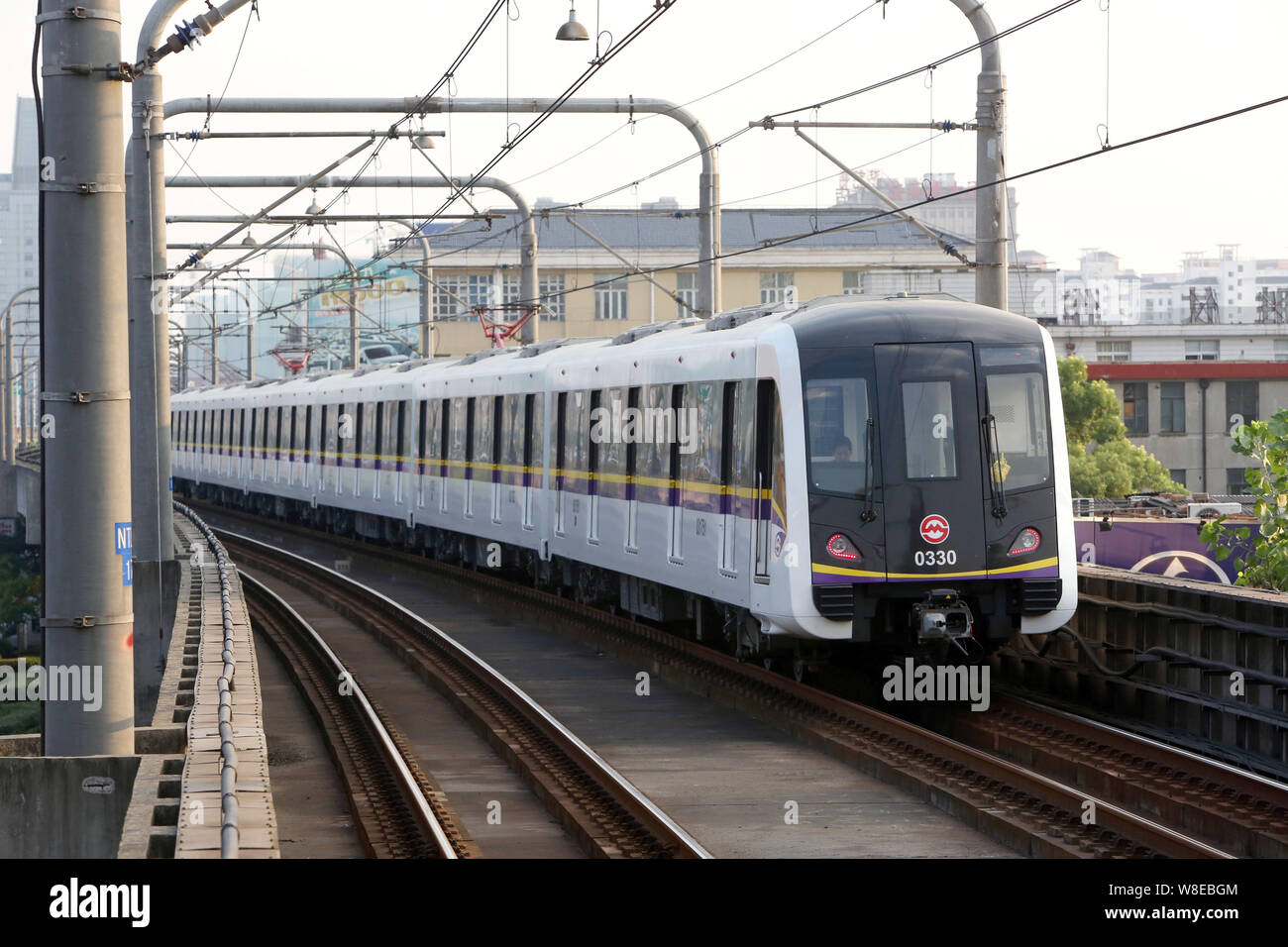--FILE--A subway train of the Shanghai Metro Line 3 leaves a station in ...