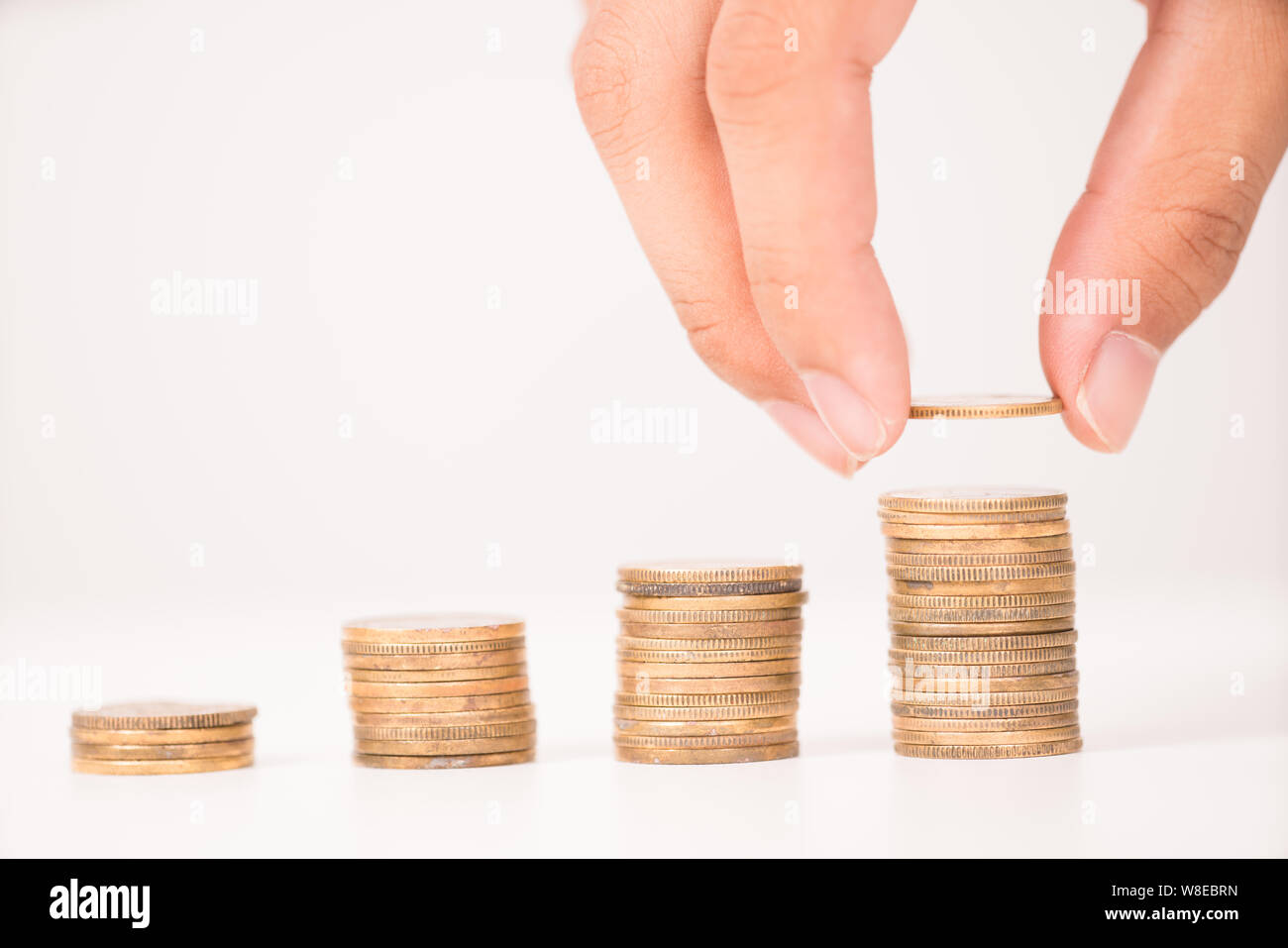 Man hand putting coins hi-res stock photography and images - Alamy