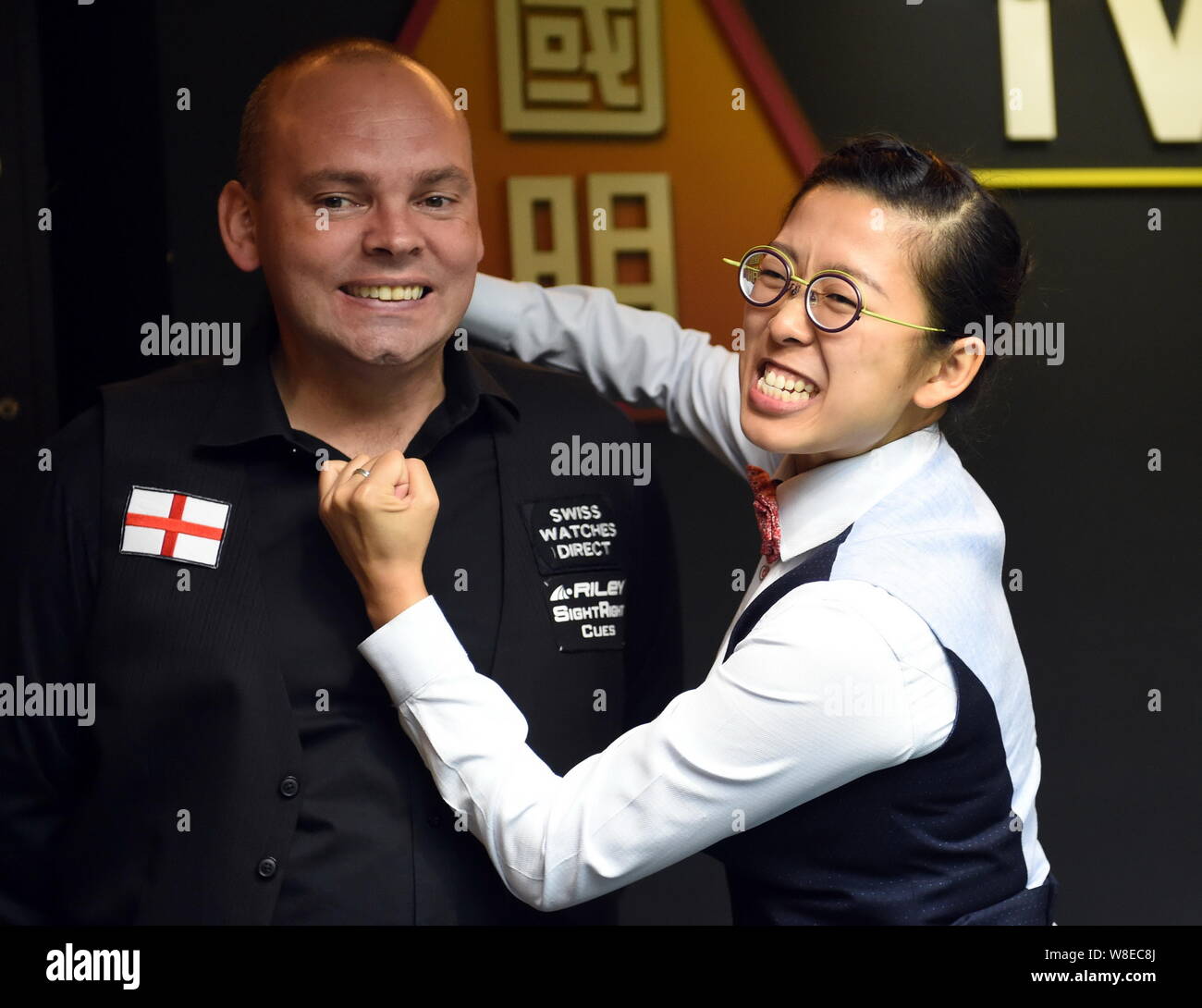Ng On Yee of Hong Kong, right, interacts with Stuart Bingham of England ...