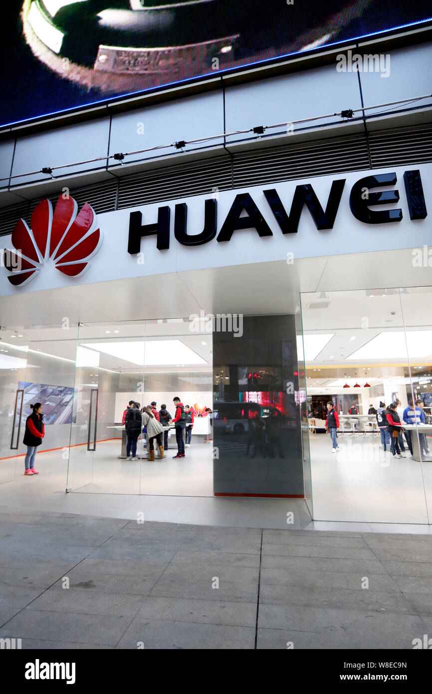 --FILE--People shop at a store of Huawei in Shanghai, China, 8 December ...